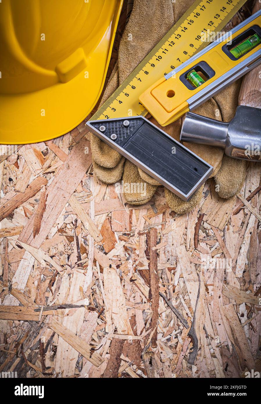 Square ruler construction level hammer yellow hard hat leather gloves ...