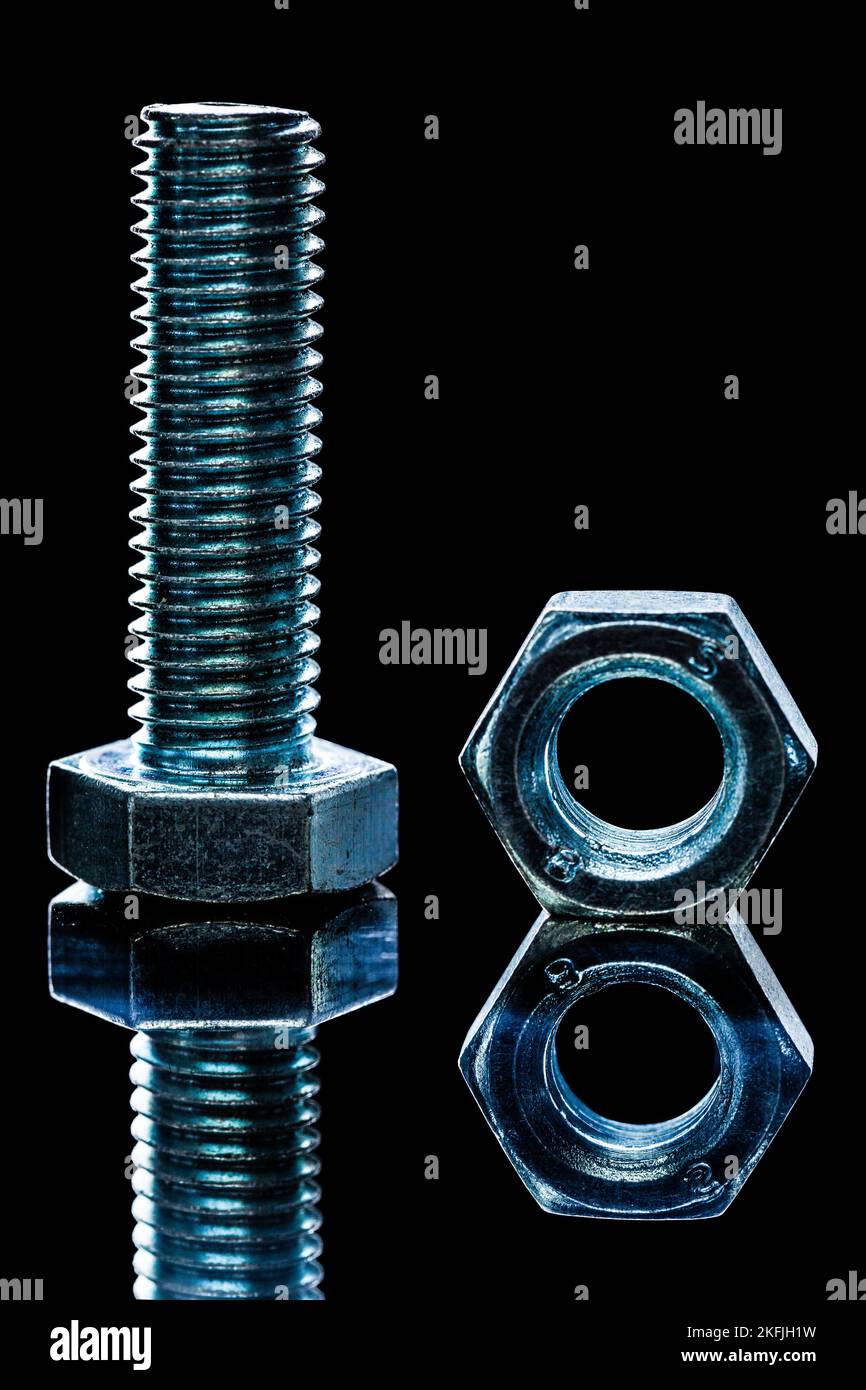 Threaded nut bolt on black background Stock Photo - Alamy