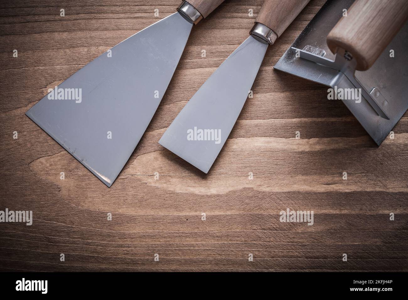 two paint scrapers and surfacer Stock Photo - Alamy