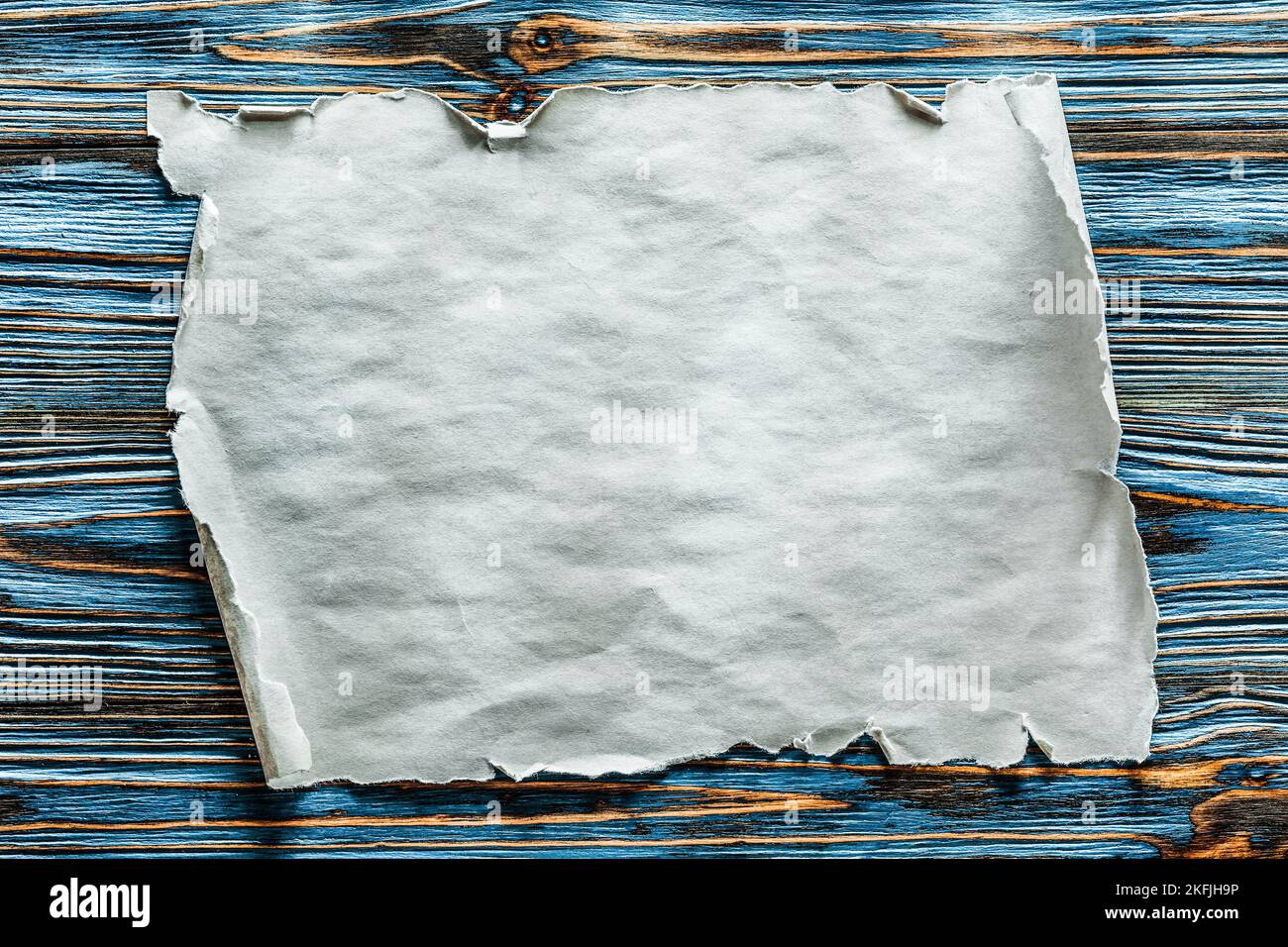 Vintage blank paper scroll on blue wooden background Stock Photo - Alamy