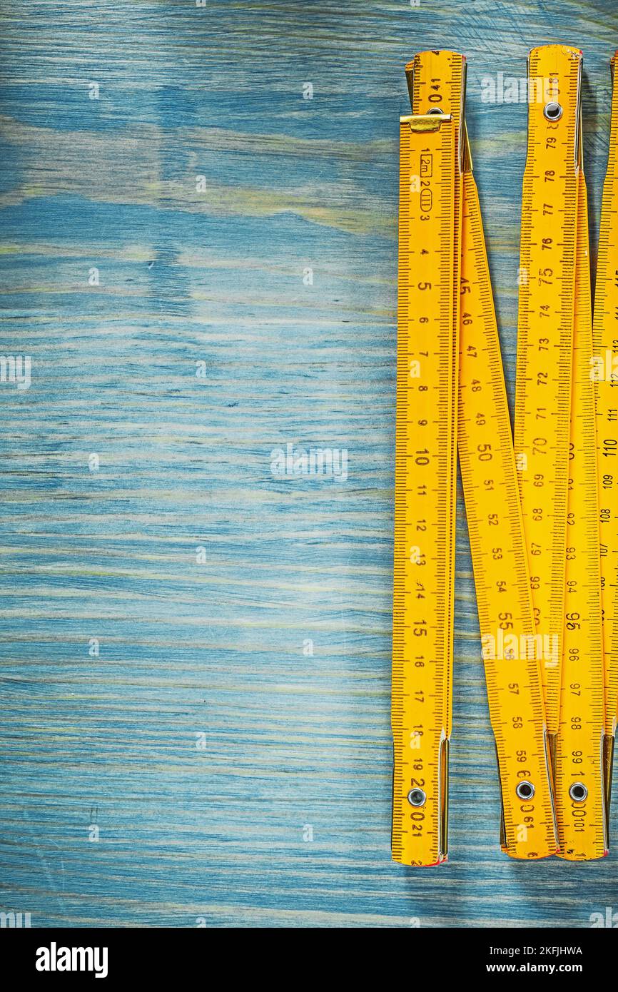 Yellow wooden meter on vintage wood surface construction concept Stock ...