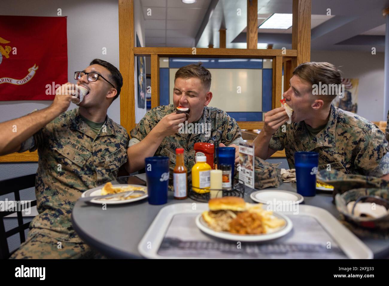 U.S. Marines with Combat Logistics Battalion (CLB) 8, eat cupcakes in ...
