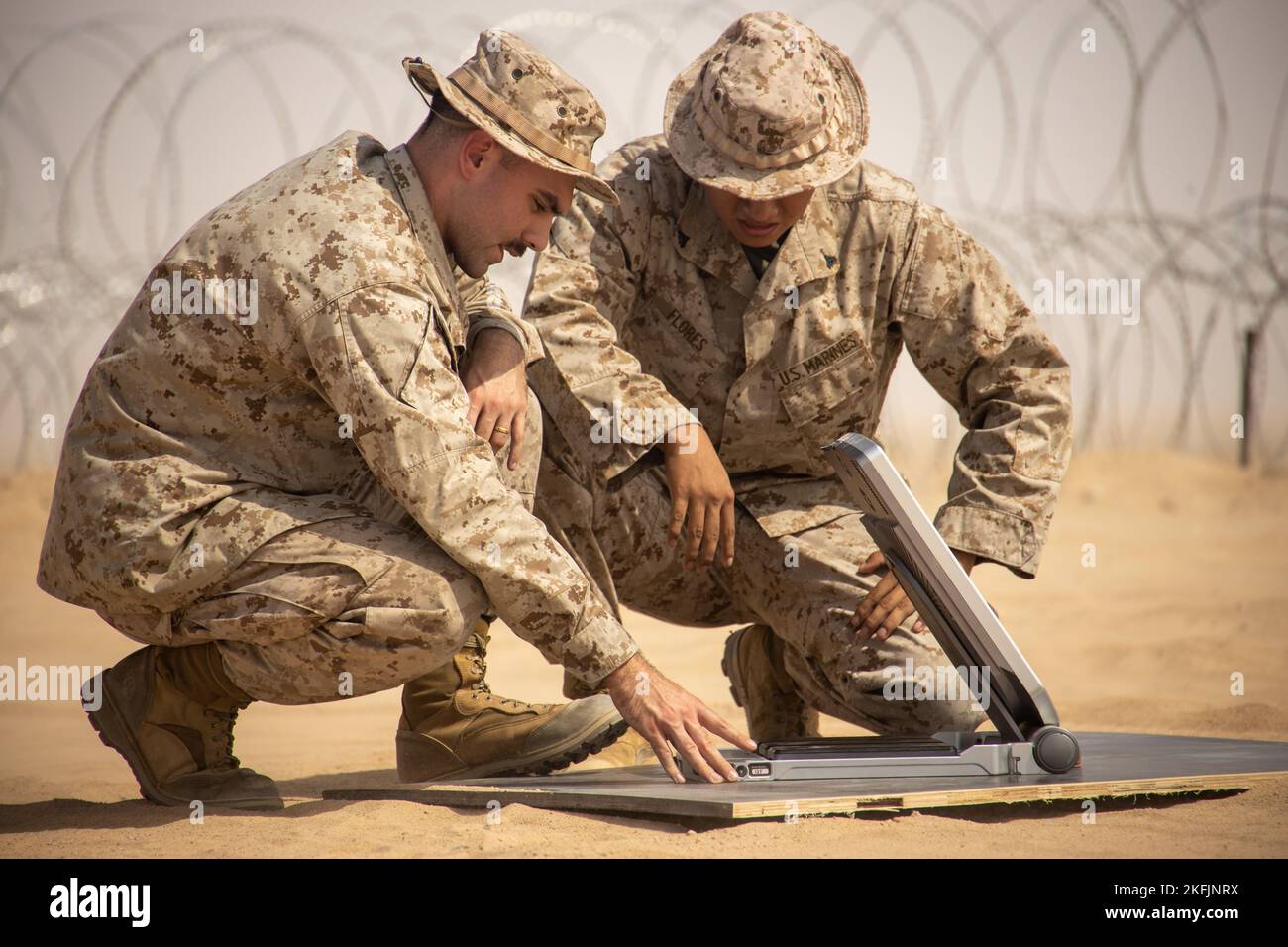 U.S. Marine Corps Sgt. Jonathan Florentino, a communications chief, and ...