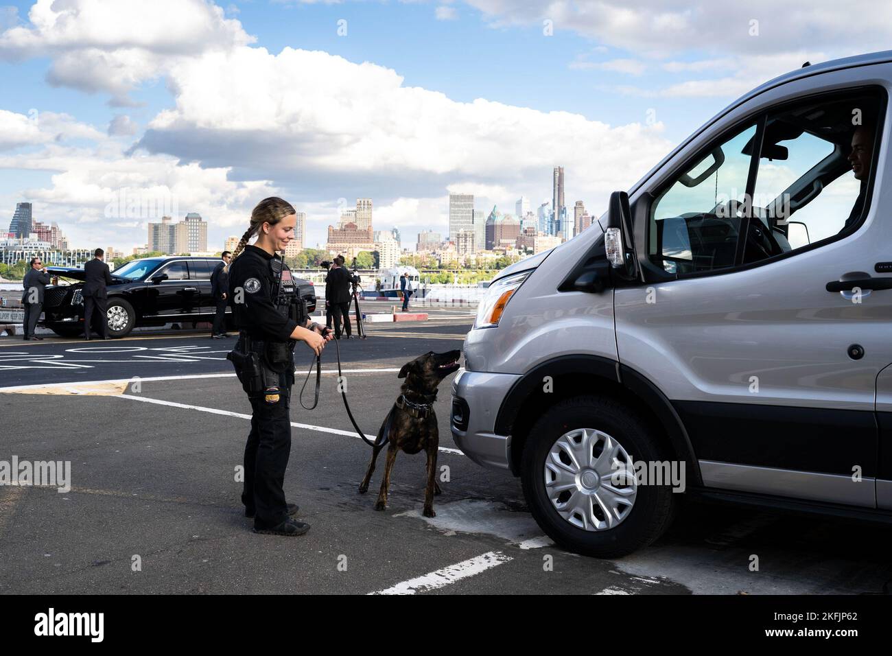 A U.S. Secret Service Uniform Division Officer and K9 Handler sweeps ...