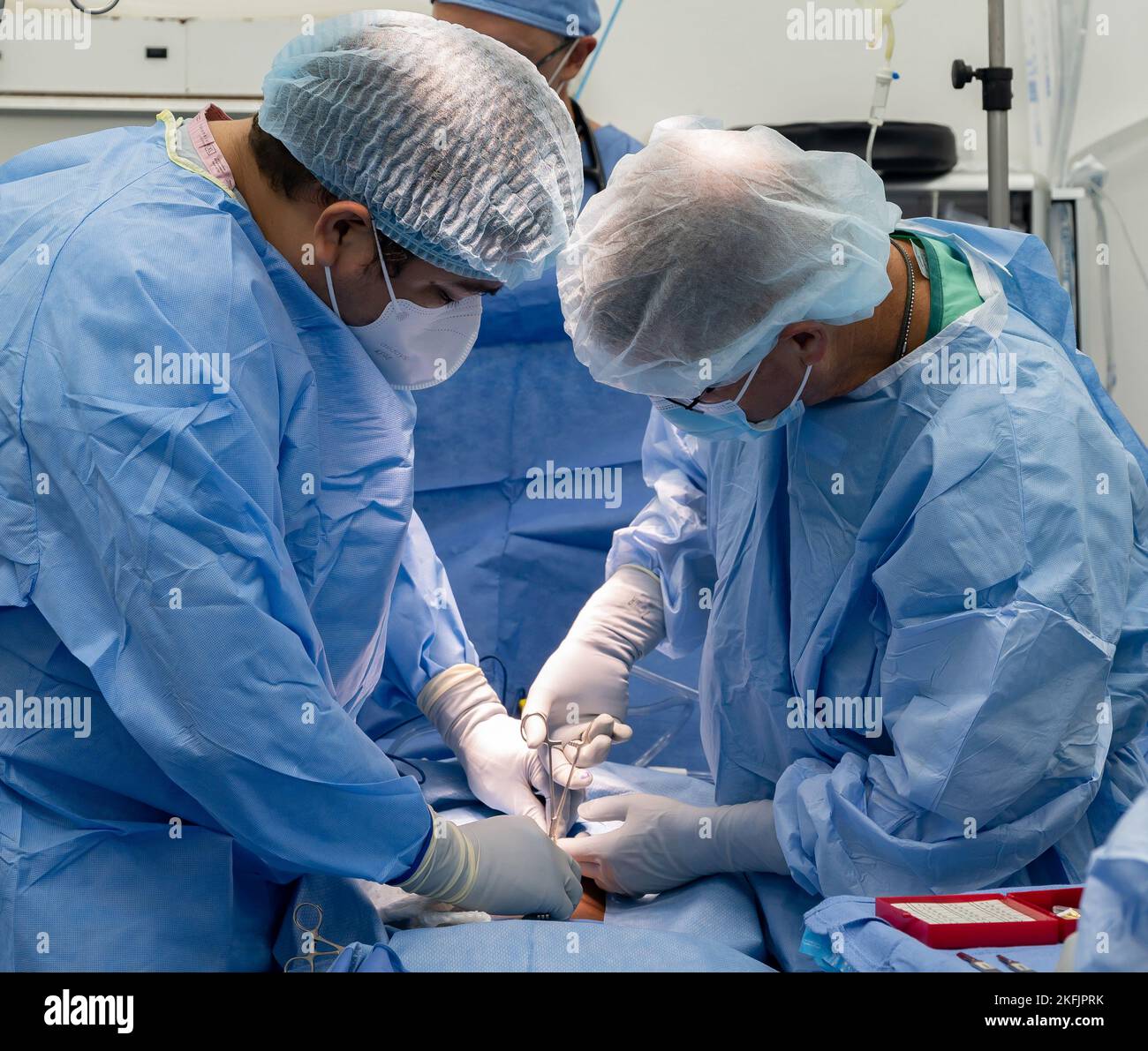 Eduardo Campos, Hospital Del Sur general surgeon, left, performs a ...