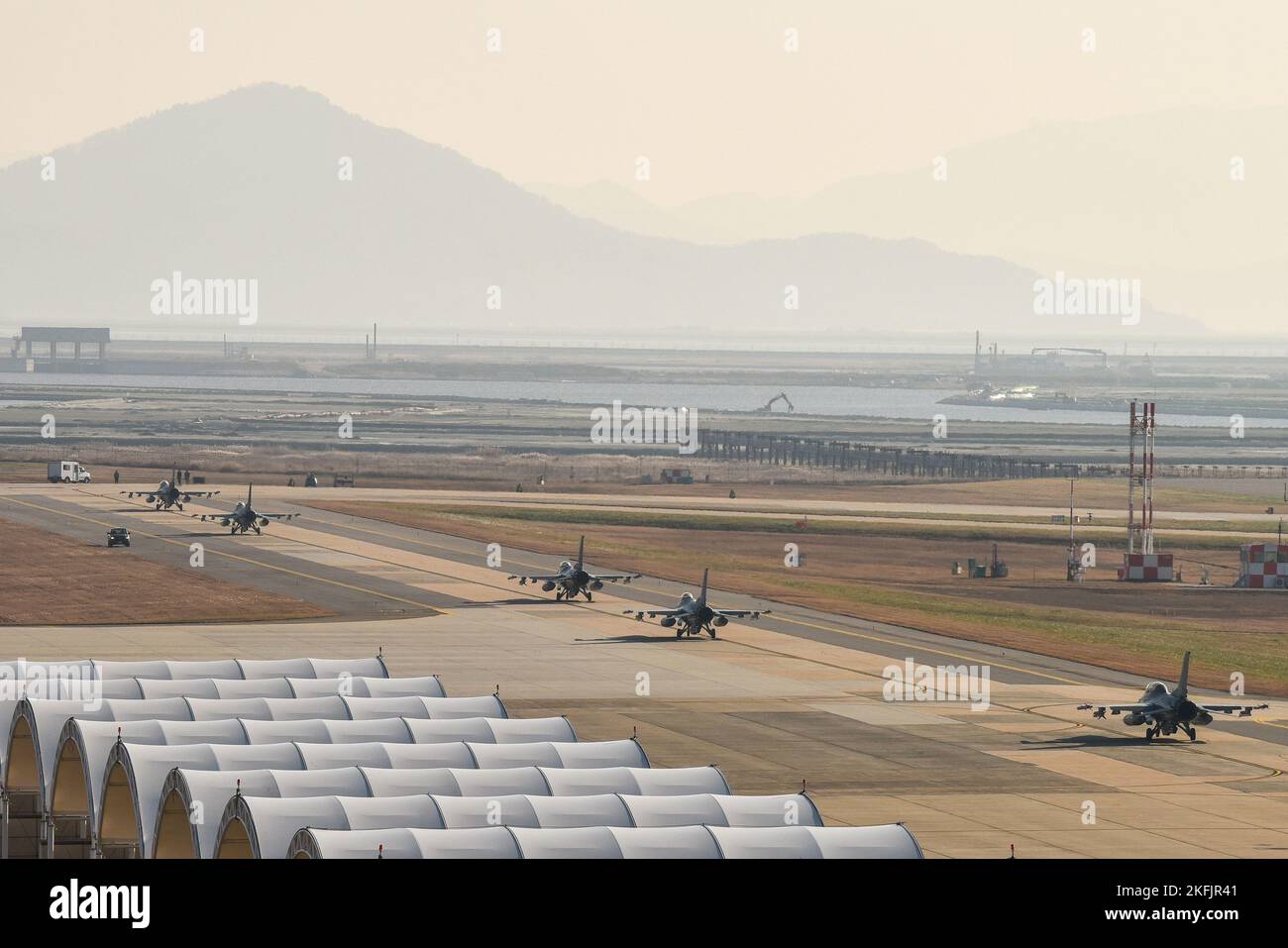 Five F-16 Fighting Falcons assigned to the 80th Fighter Squadron taxi ...