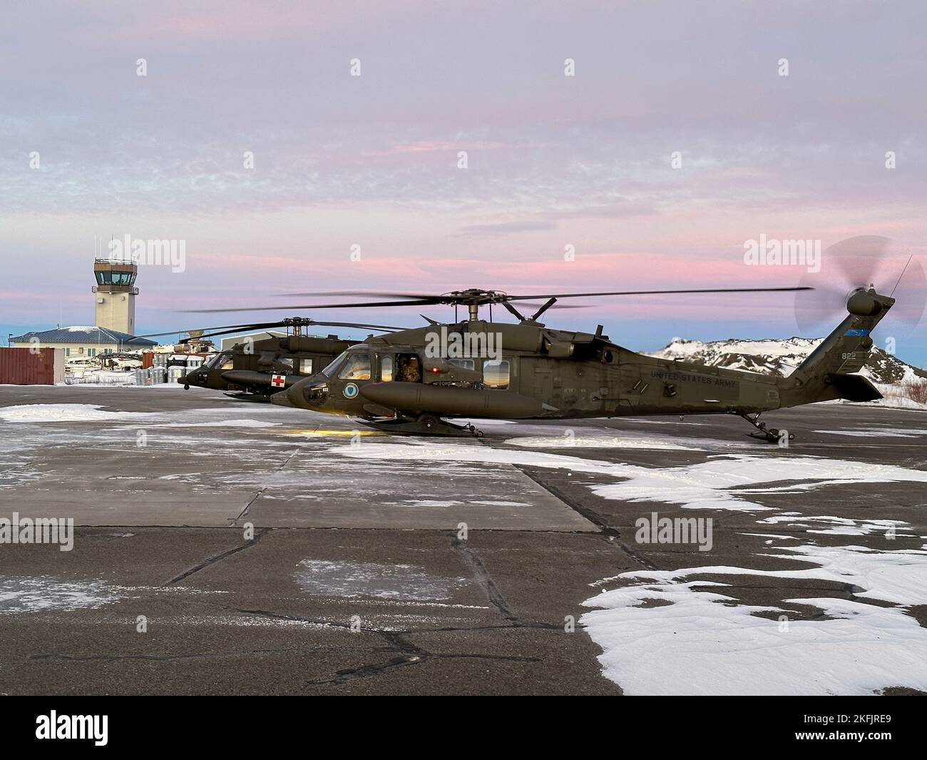 Two Alaska Army National Guard Black Hawk helicopters prepare to depart ...