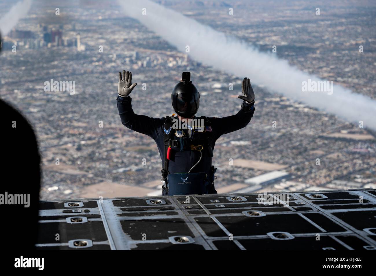 A U.S. Air Force Academy Wings of Blue member jumps out of a C-130J ...