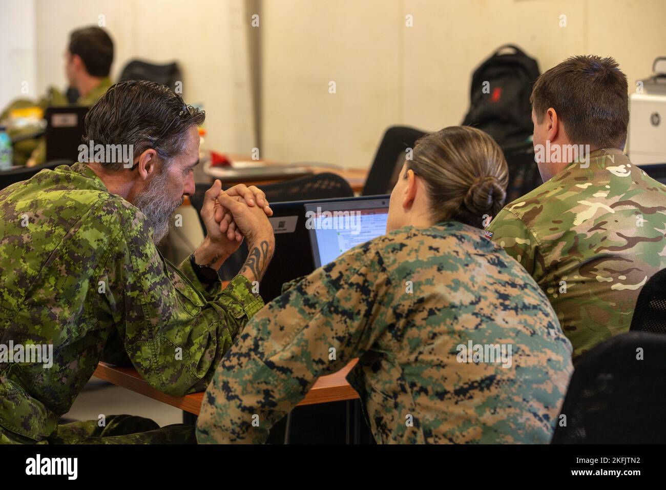 Joint force service members participate in the war gaming phase during ...