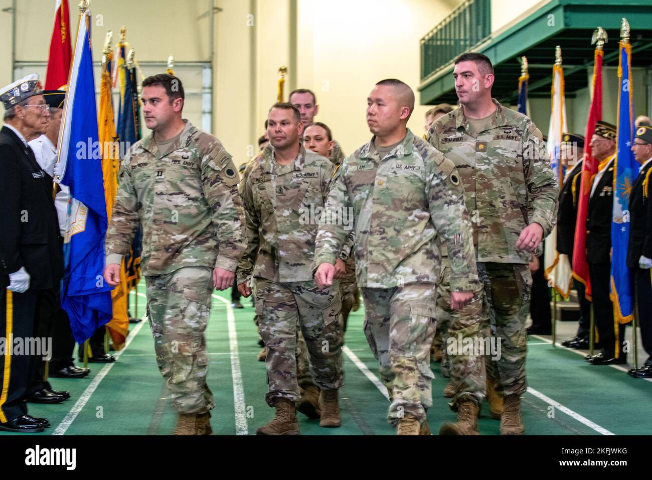 Passing through an honor guard consisting of local veterans service ...