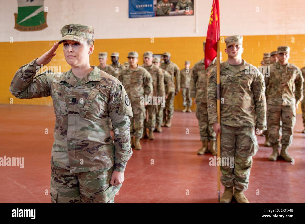 U.S. Army Capt. Jennifer Wain salutes at a change of command ceremony ...