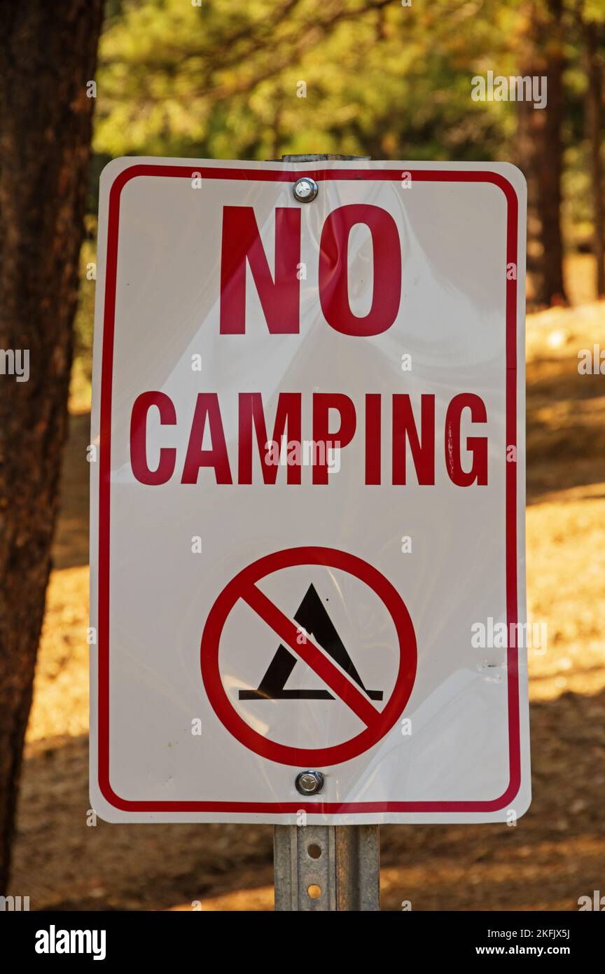 metal white no camping sign with red writing Stock Photo - Alamy