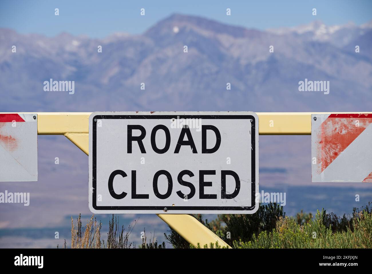 road closed sign on a metal gate with out of focus Mount Tom in the ...