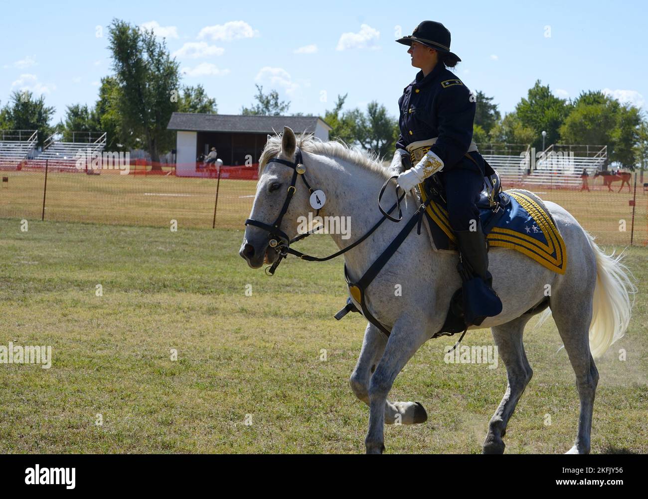 1st Lt. Madeline Miller, the Fort Carson Mountain Color Guard (FCMCG) commander, warms up her ...