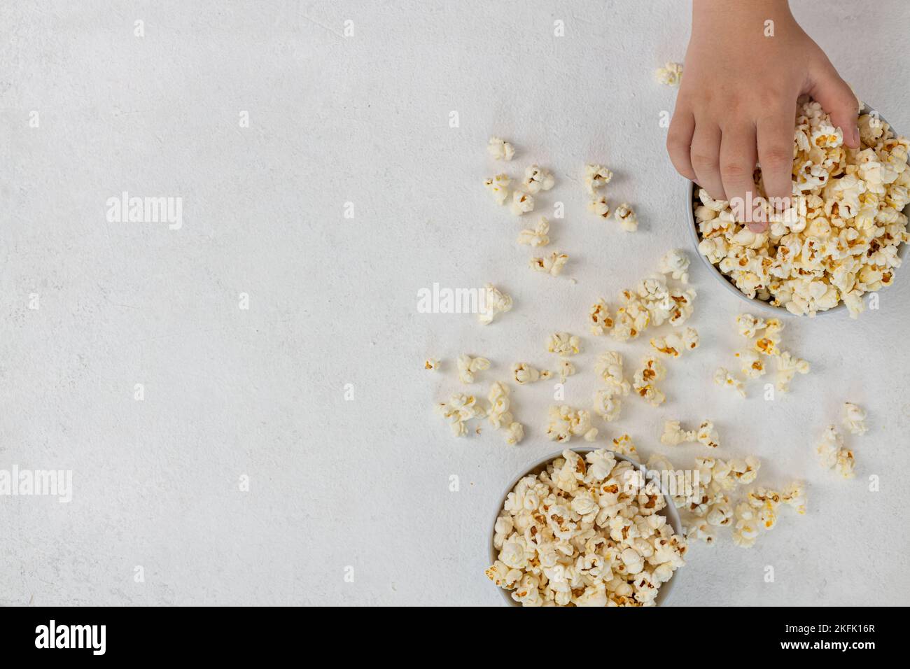 A bowl of delicious popcorn on a light background, natural delicious ...