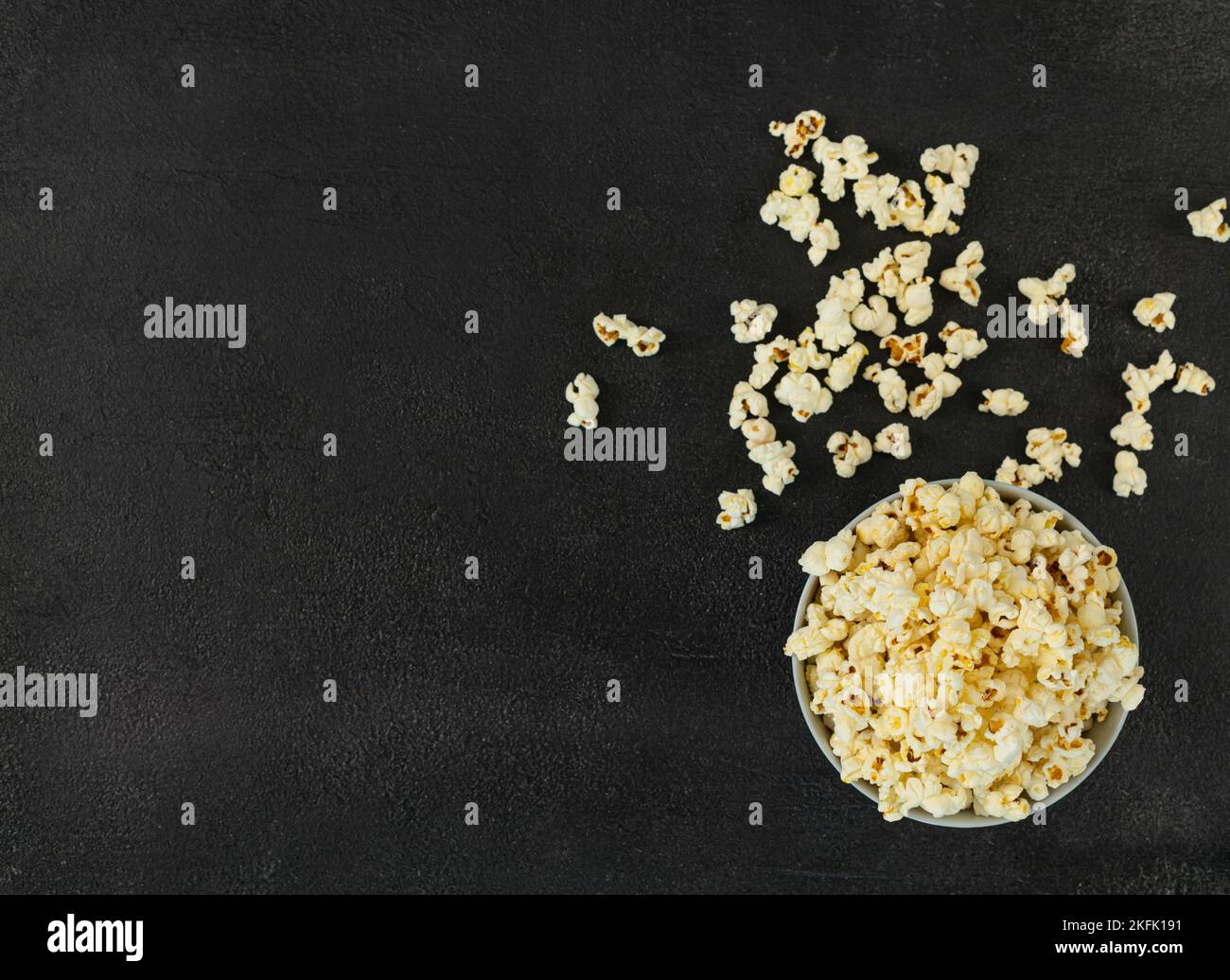 A bowl of delicious popcorn on a dark background, natural delicious ...