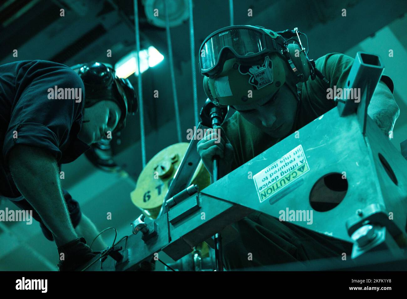 U.S. Marine Corps Cpl. Joseph Diiacovo, left, an F-35B power line ...