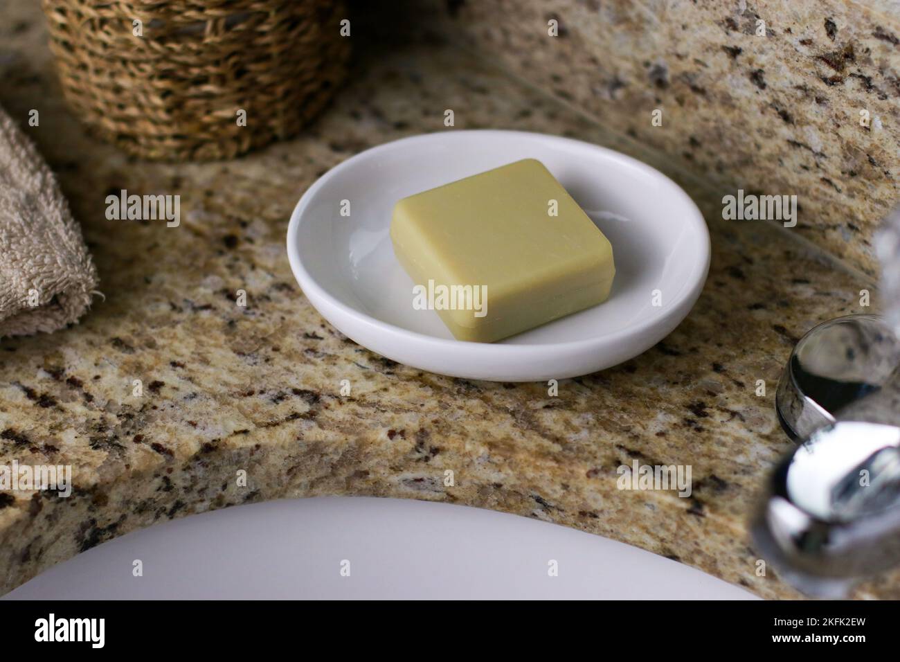 a bar of zero waste soap on white dish at bathroom sink Stock Photo - Alamy