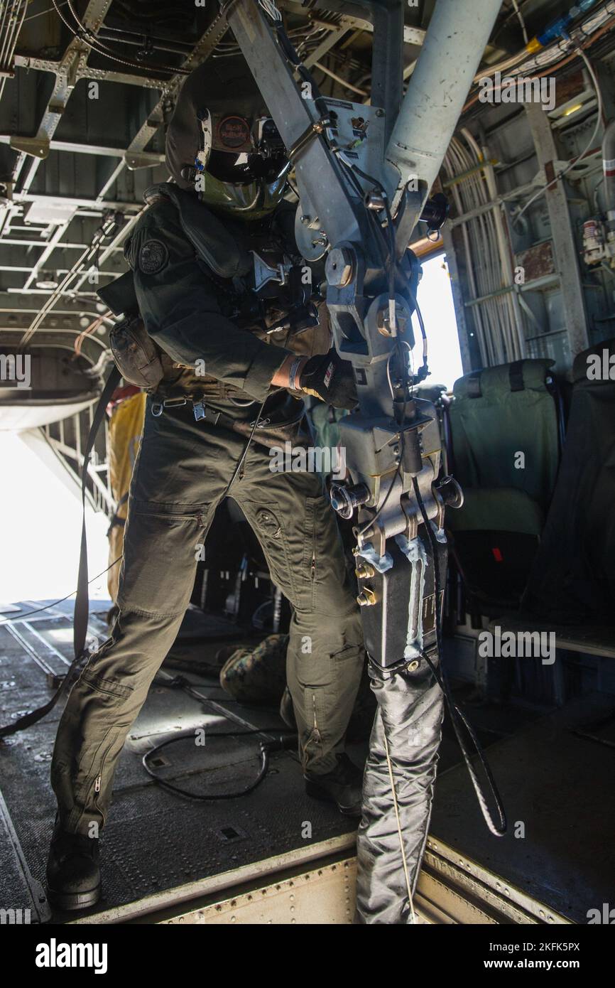 A CH-53E Super Stallion aircrewman flies with the Marine Air-Ground ...
