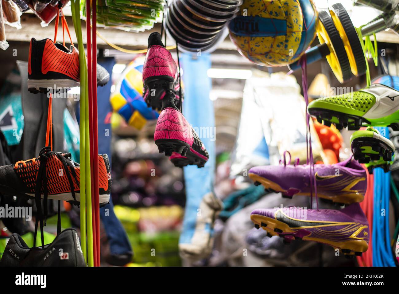 Soccer Cleats are hanging intron of a retail store Stock Photo - Alamy