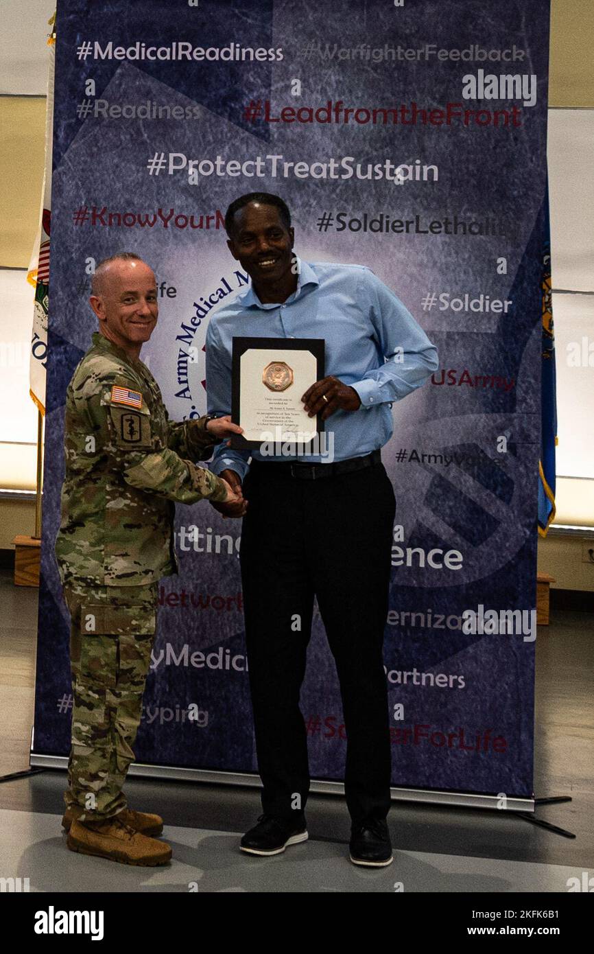Col. Andy Nuce presents Samuels Kenner a 10 year Service Award ...