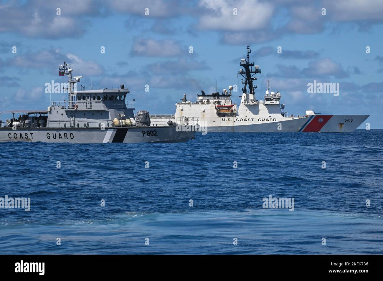 U.S. Coast Guard Cutter Midgett (WMSL 757) transits alongside the ...