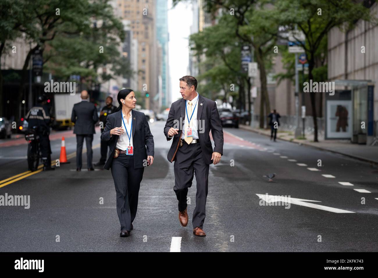 U.S. Secret Service Agents speak with each other while walking to a ...