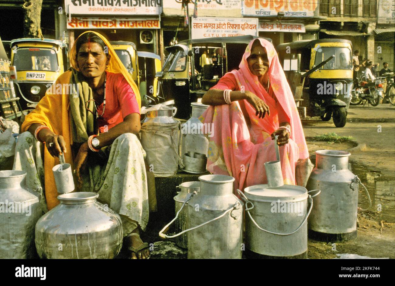 Local women selling fresh cow's milk, Jaipur, Rajasthan, India Stock ...