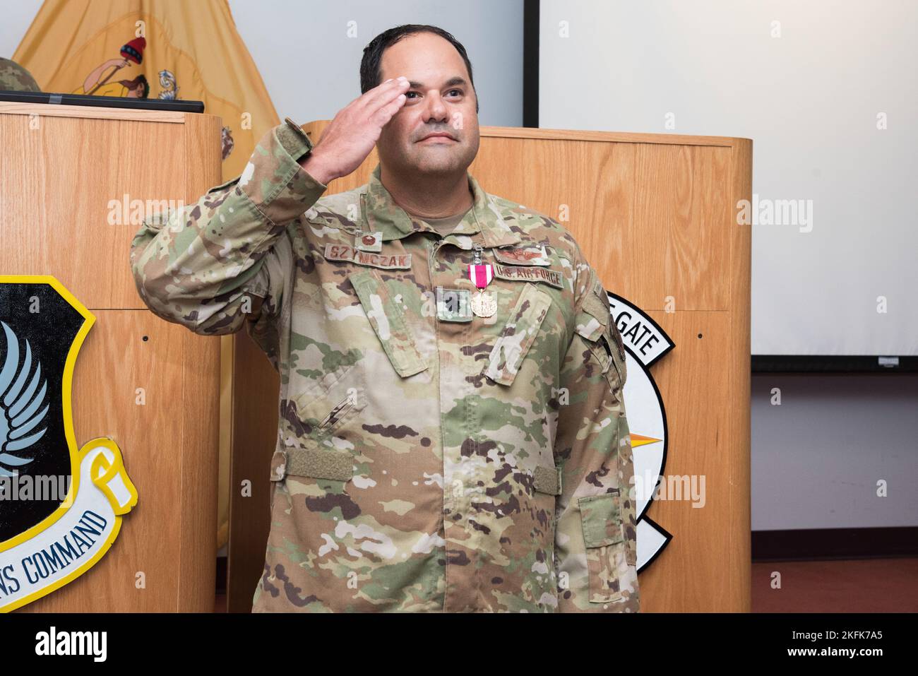 Lt. Col. Kristopher Szymczak gives a final salute during a change of ...