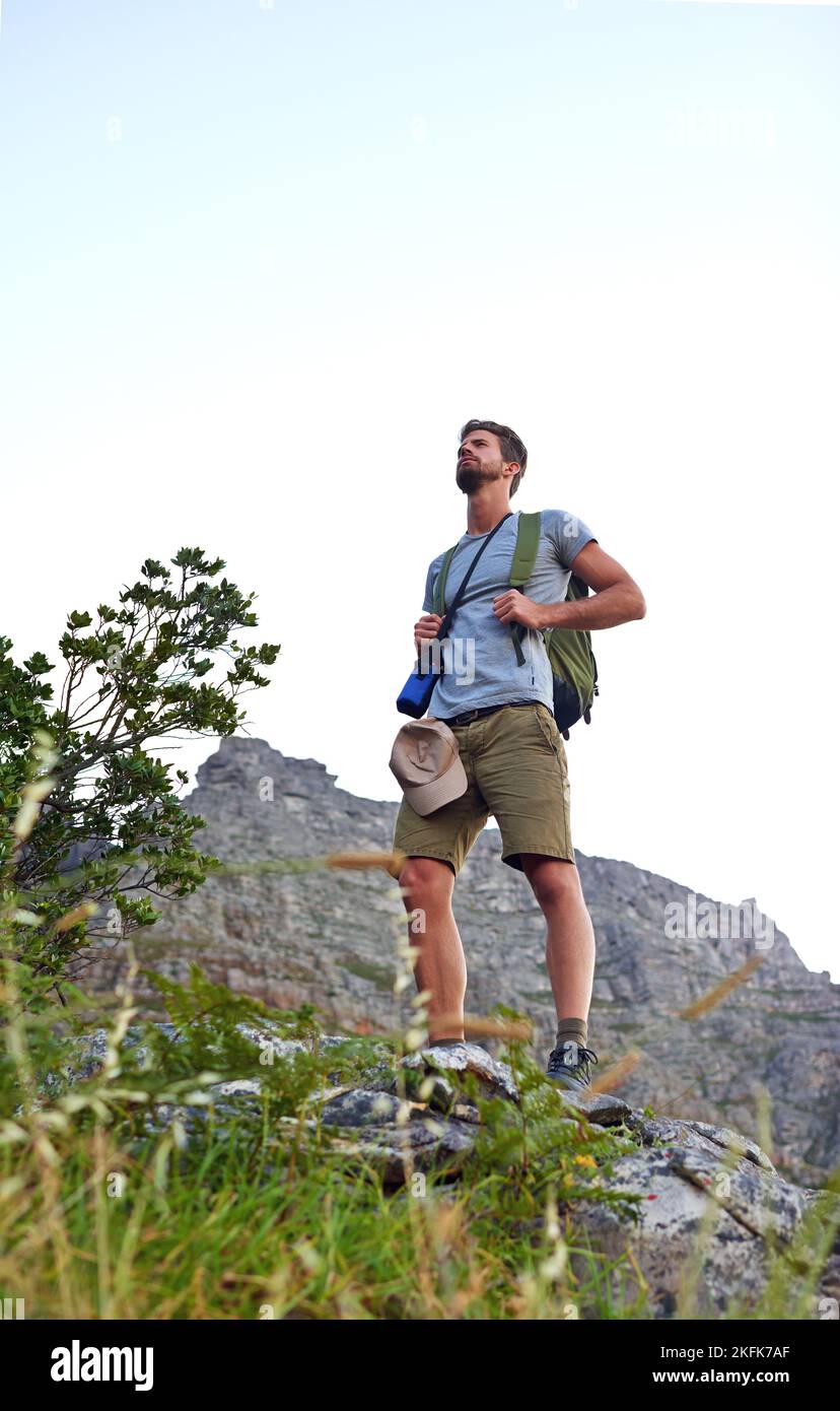 He loves being active. a handsome young man enjoying the view while ...