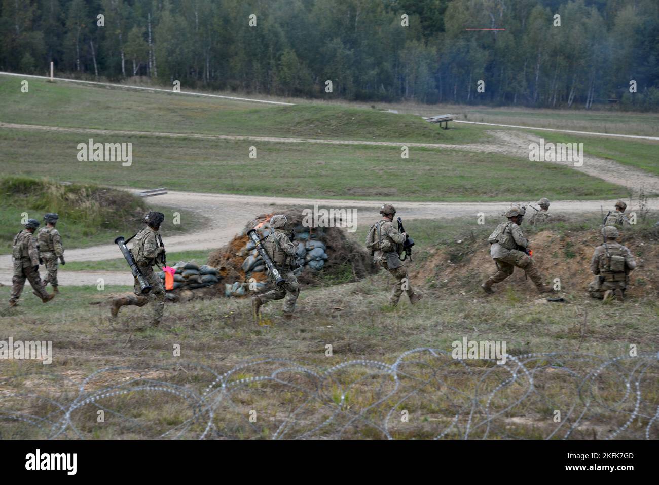 U.S. Army paratroopers assigned to 173rd Airborne Brigade Combat Team maneuver to engage targets ...