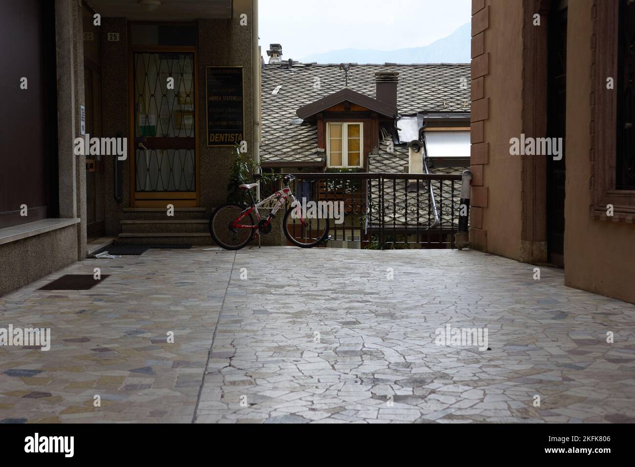 A corridor of a house with a bicycle and a view of a roof Stock Photo ...