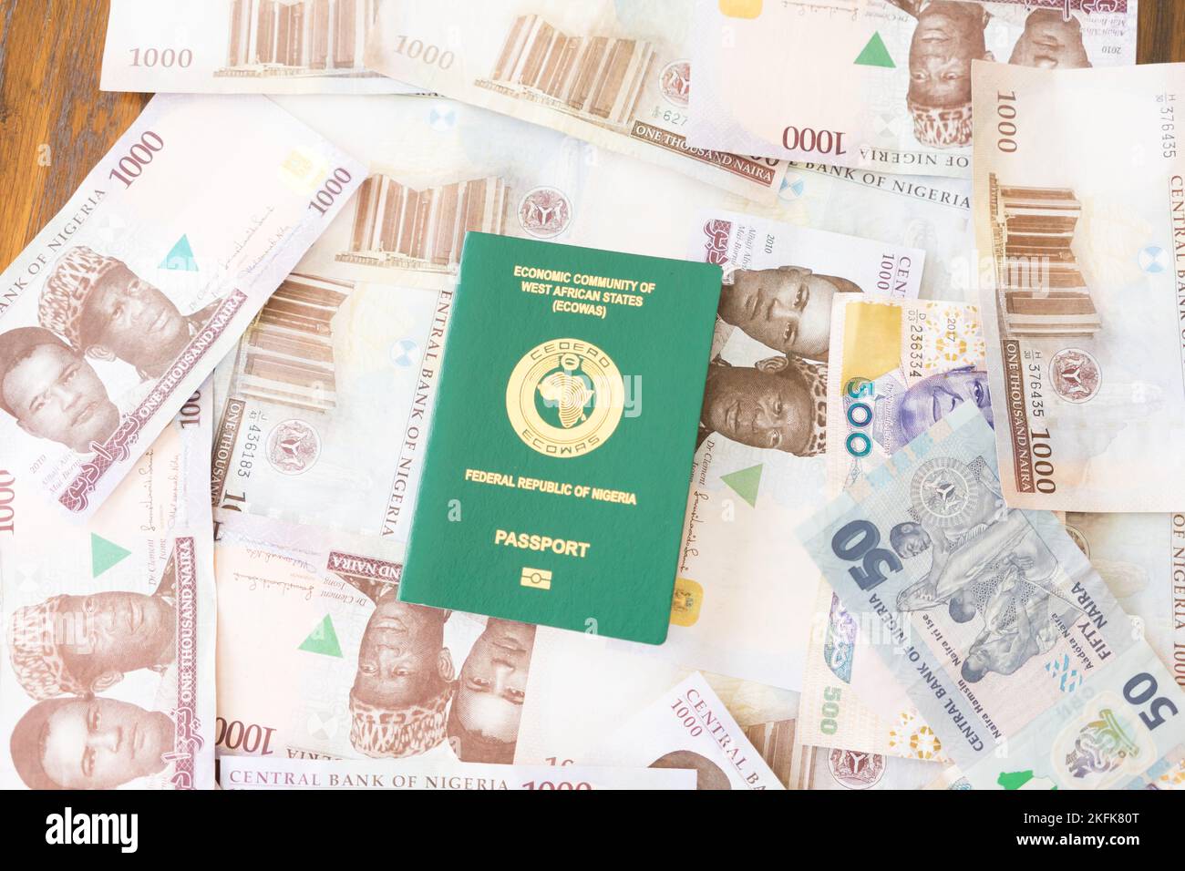 Nigerian Ecowas Passport on top of Nigerian Naira Stock Photo - Alamy