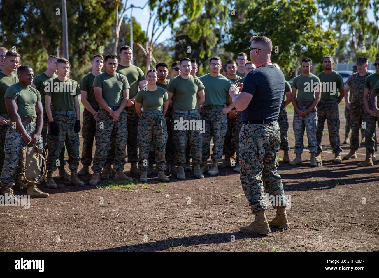 U.S. Marines with Headquarters and Service Battalion, receive a brief ...
