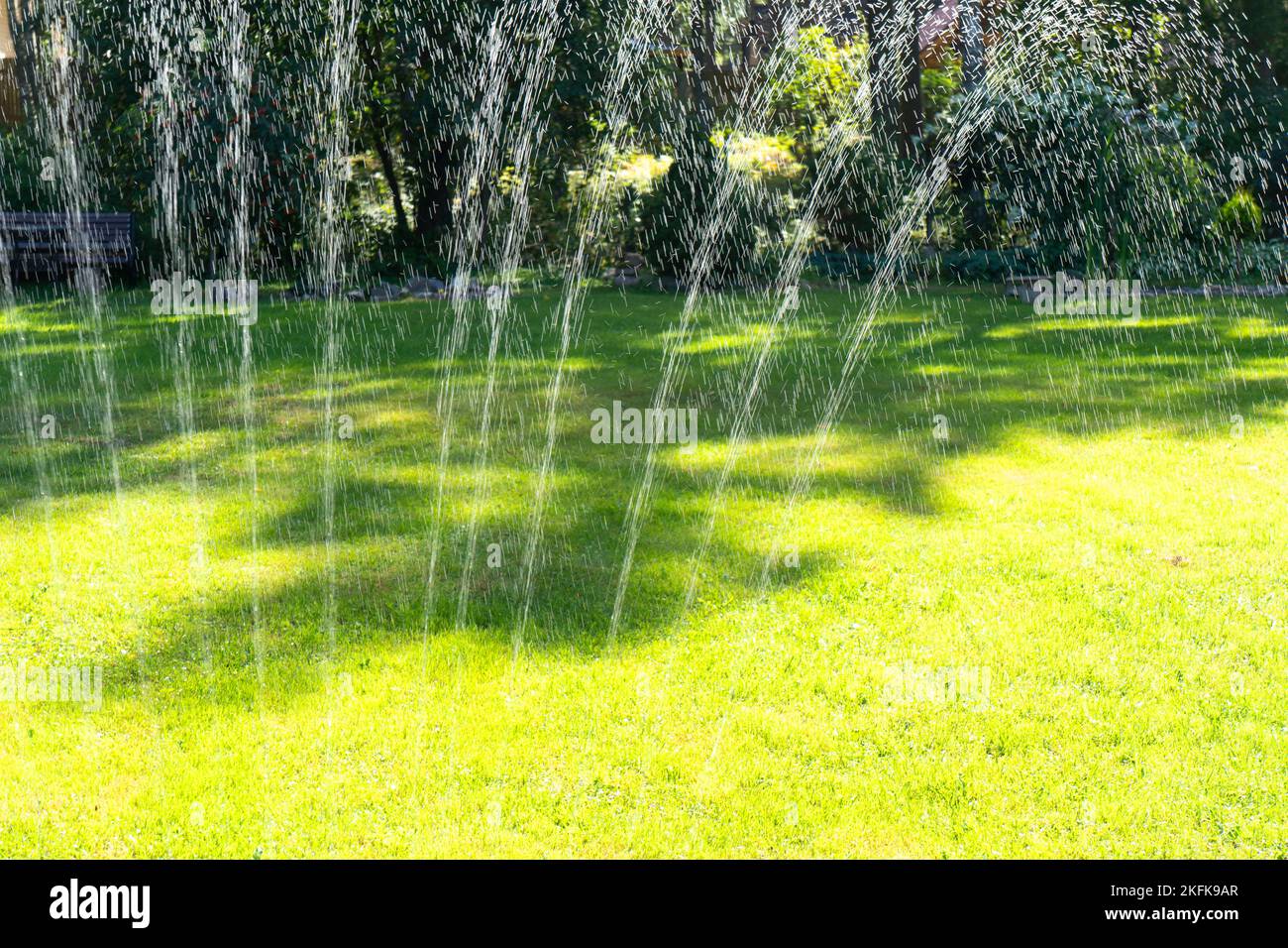 Garden irrigation system lawn. Automatic lawn sprinkler watering green ... Garden irrigation system lawn. Automatic lawn sprinkler watering green ...