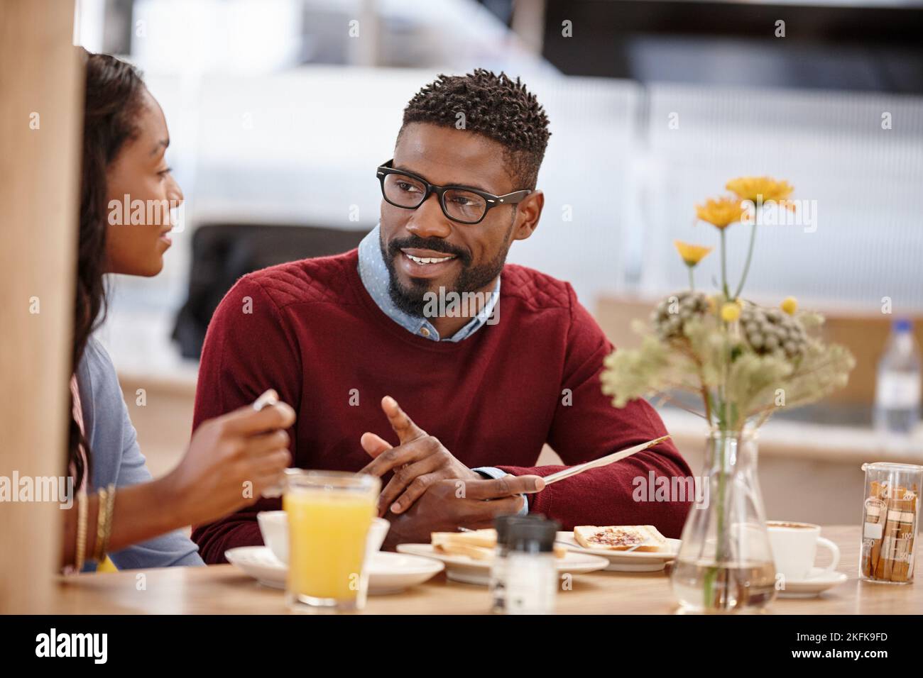 Coffee shop conversation. a young couple enjoying each others company ...