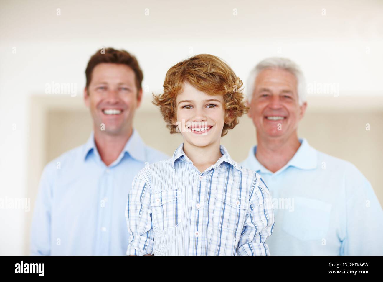 Three smiles just for you. Cropped portrait of a young boy standing ...