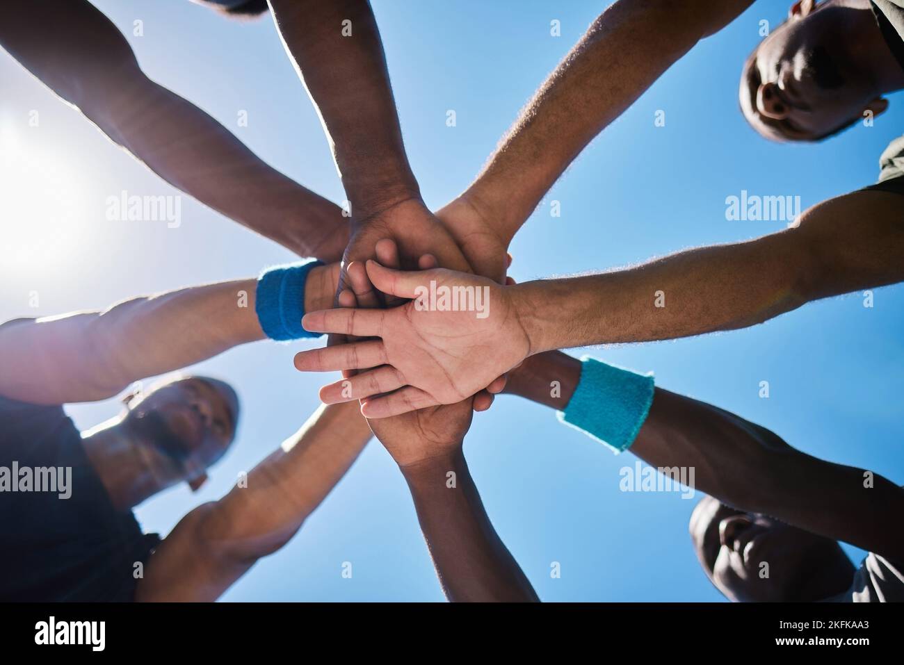 Hands, teamwork and unity for motivation below in sports collaboration, strategy or game ...
