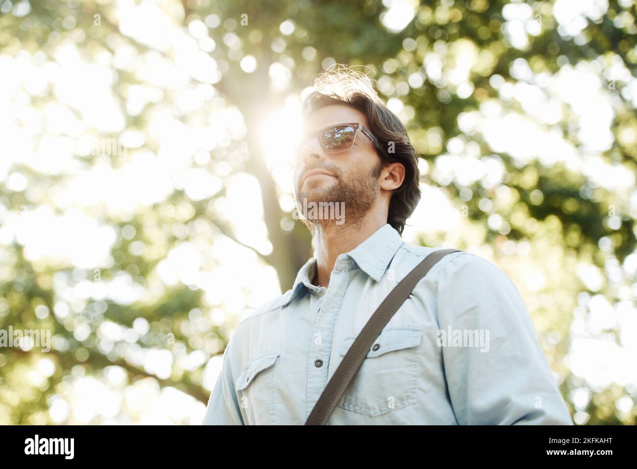 Adventure is worthwhile. a handsome young tourist checking out the ...