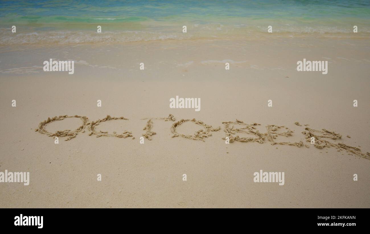 October Calendar Year Beach Inscription On Sand Stock Photo - Alamy