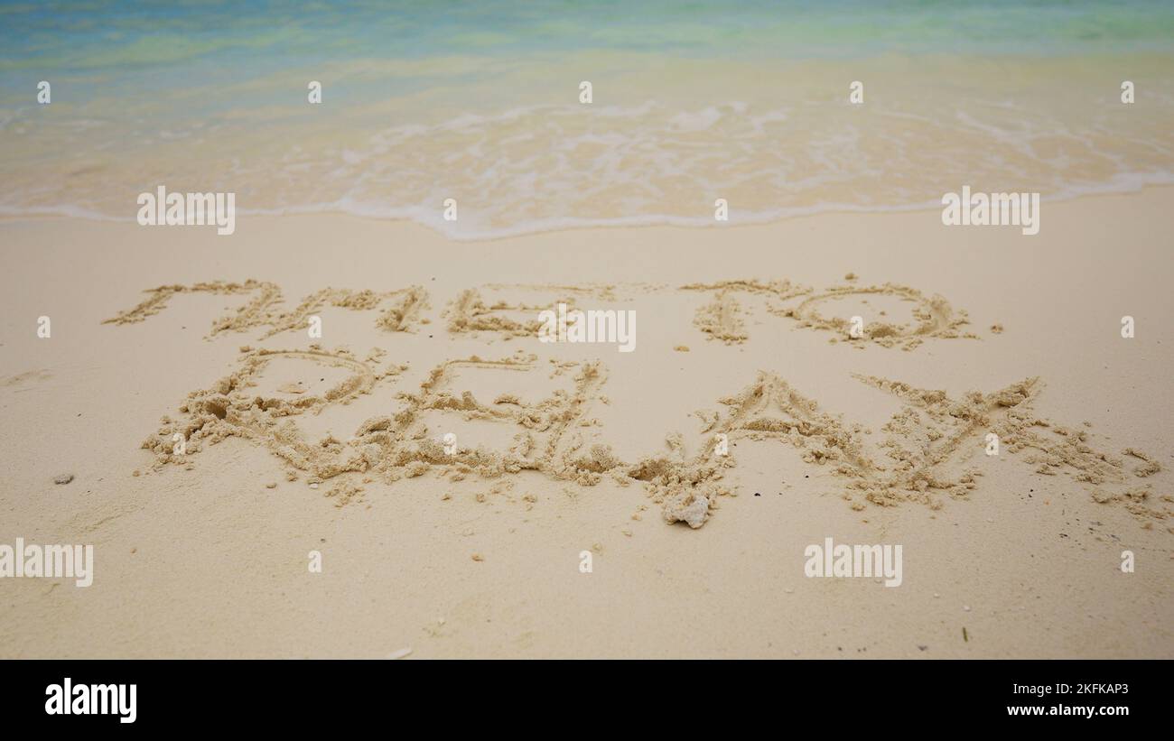 Time To Relax Text Written On Sand Near The Coast At Beach Stock Photo ...