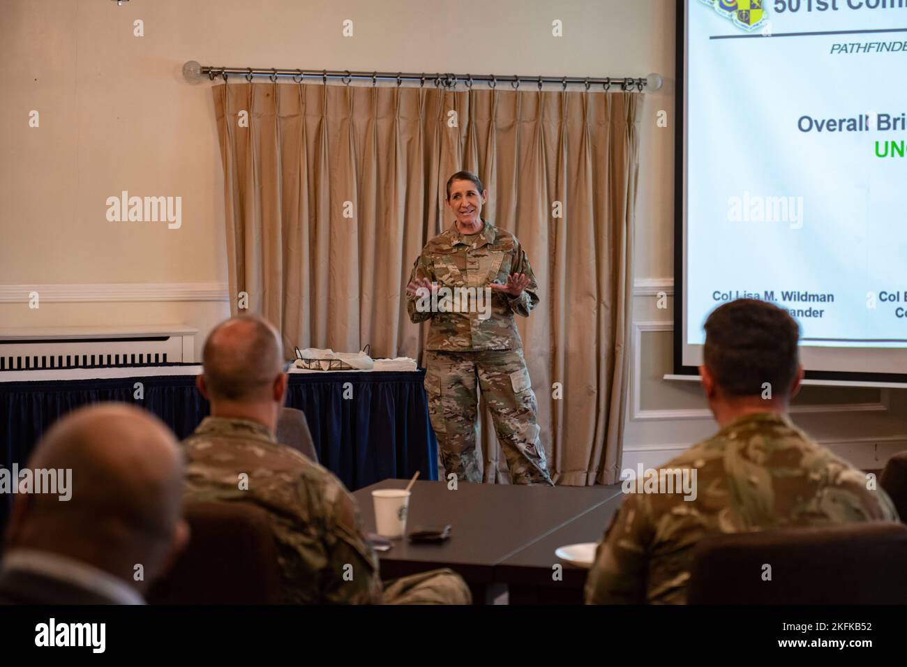 Col. Lisa Wildman, 501st Combat Support Wing vice commander, center ...