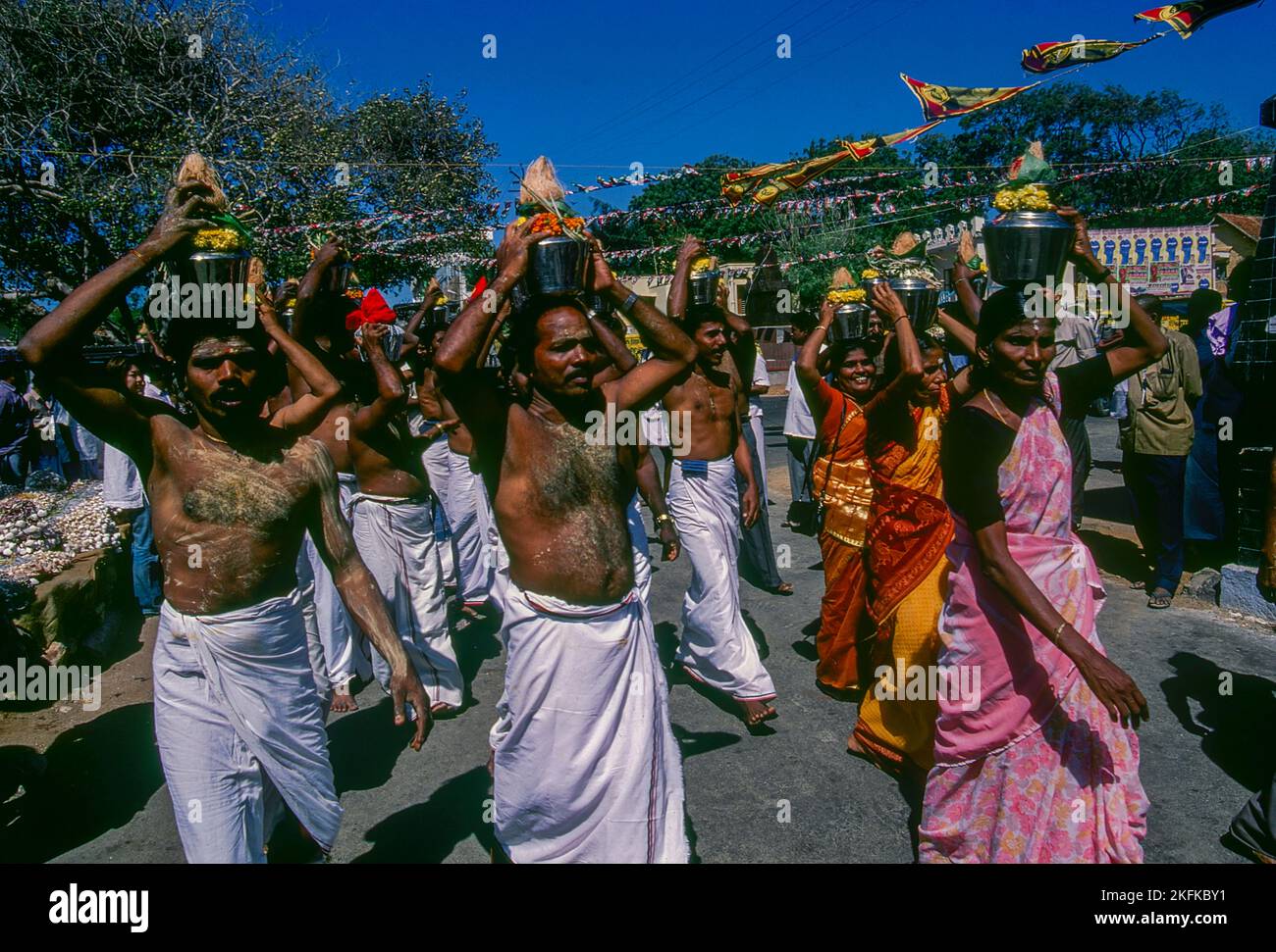 Indian Tamil Hindu devotees participate in a religious procession ...