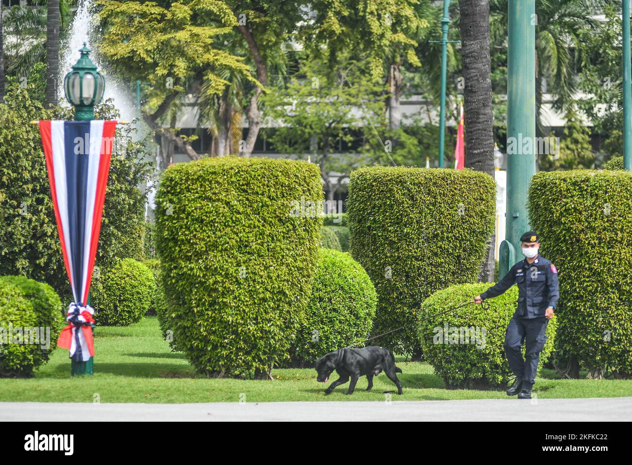 A K-9 officer ensures security before the arrival of Xi Jinping ...