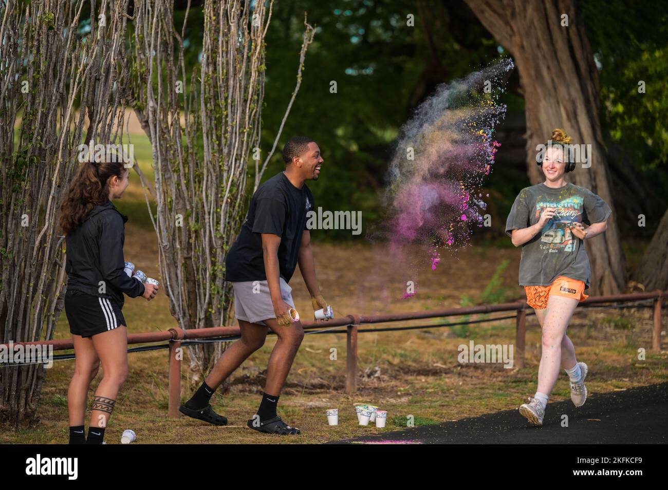 Airmen throw colored chalk during a 5K Fun Run at Joint Base Pearl ...