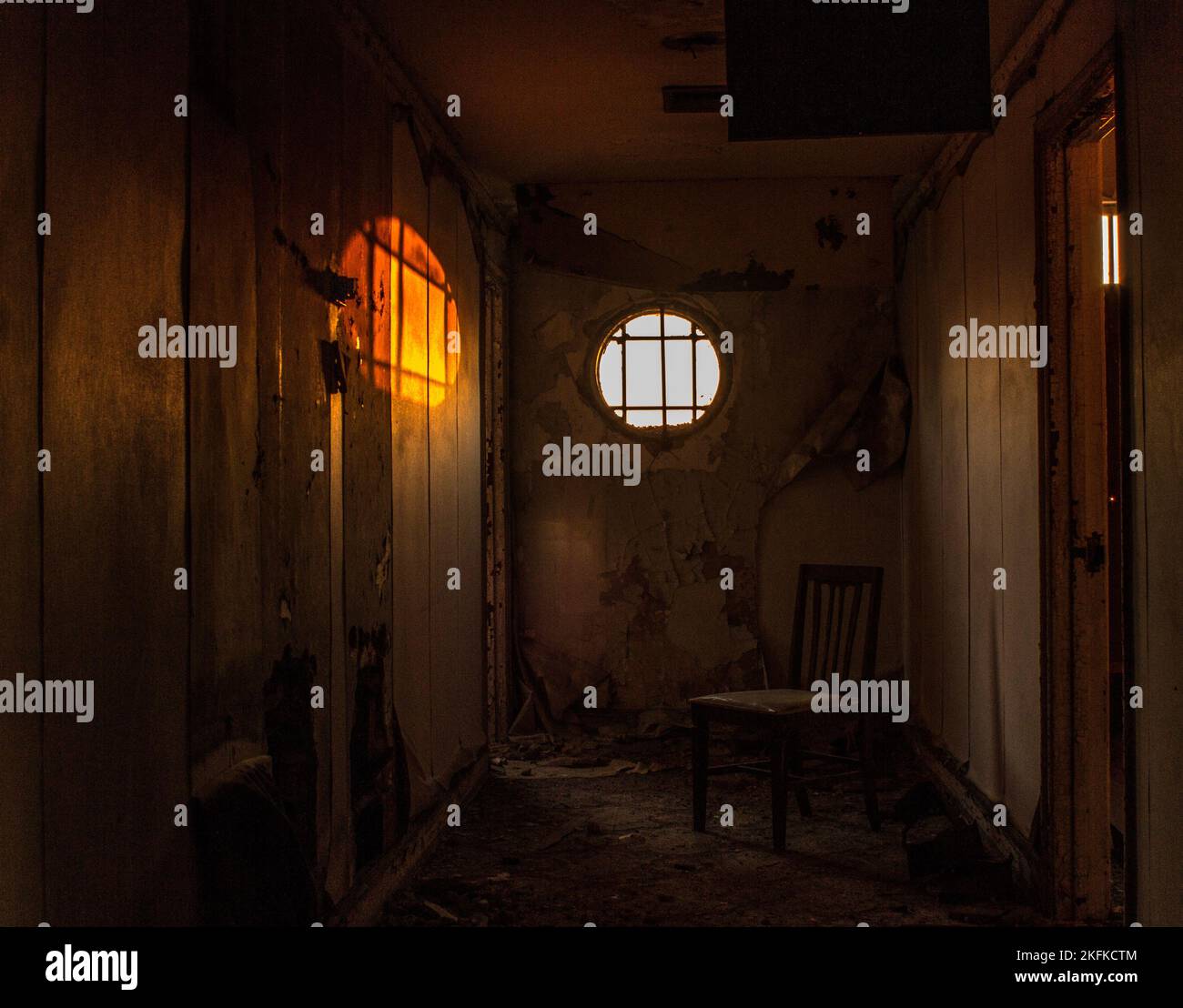 An interior view of an old, abandoned apartment with worn-out furniture ...