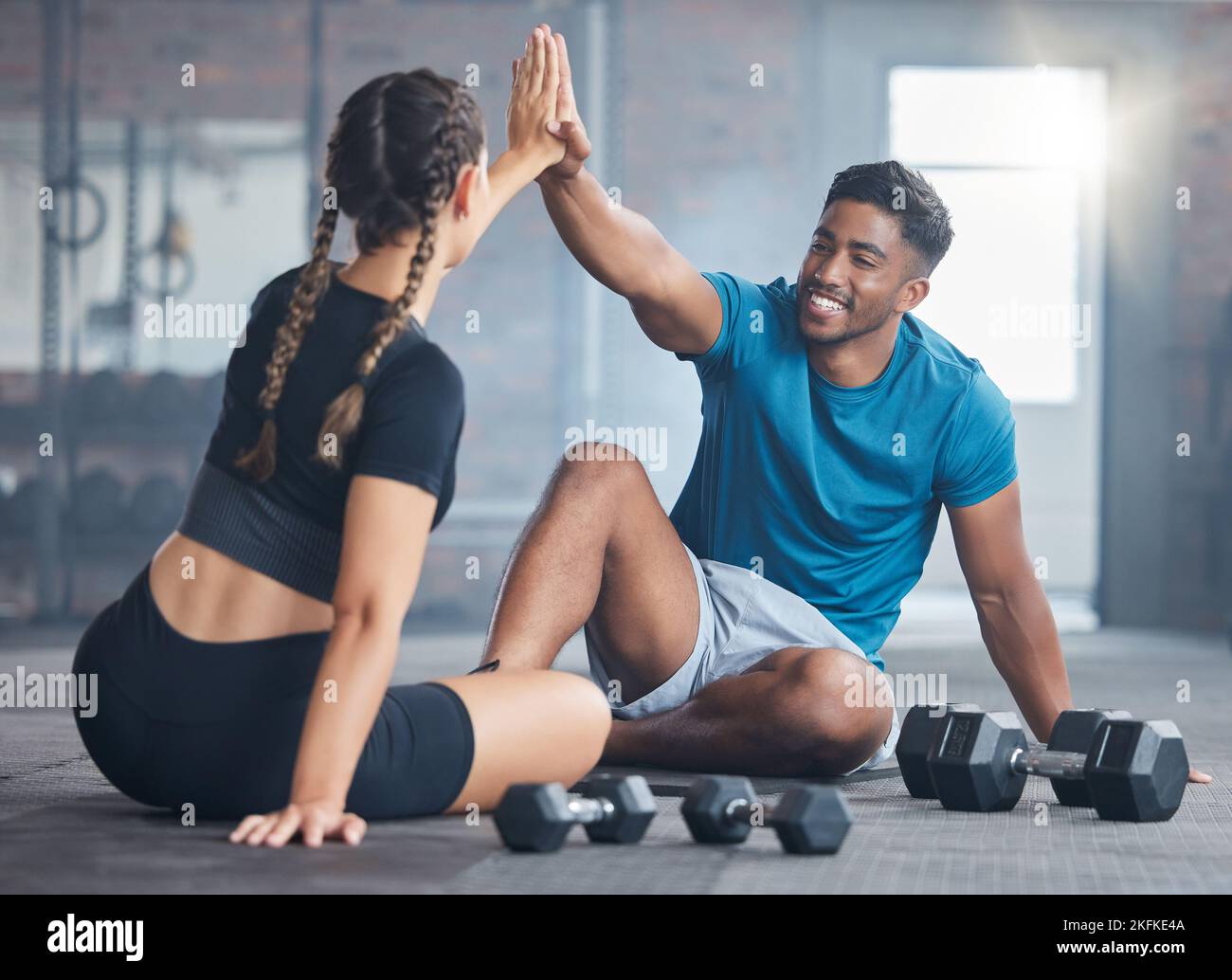 Fitness couple, high five and personal trainer with woman client to ...