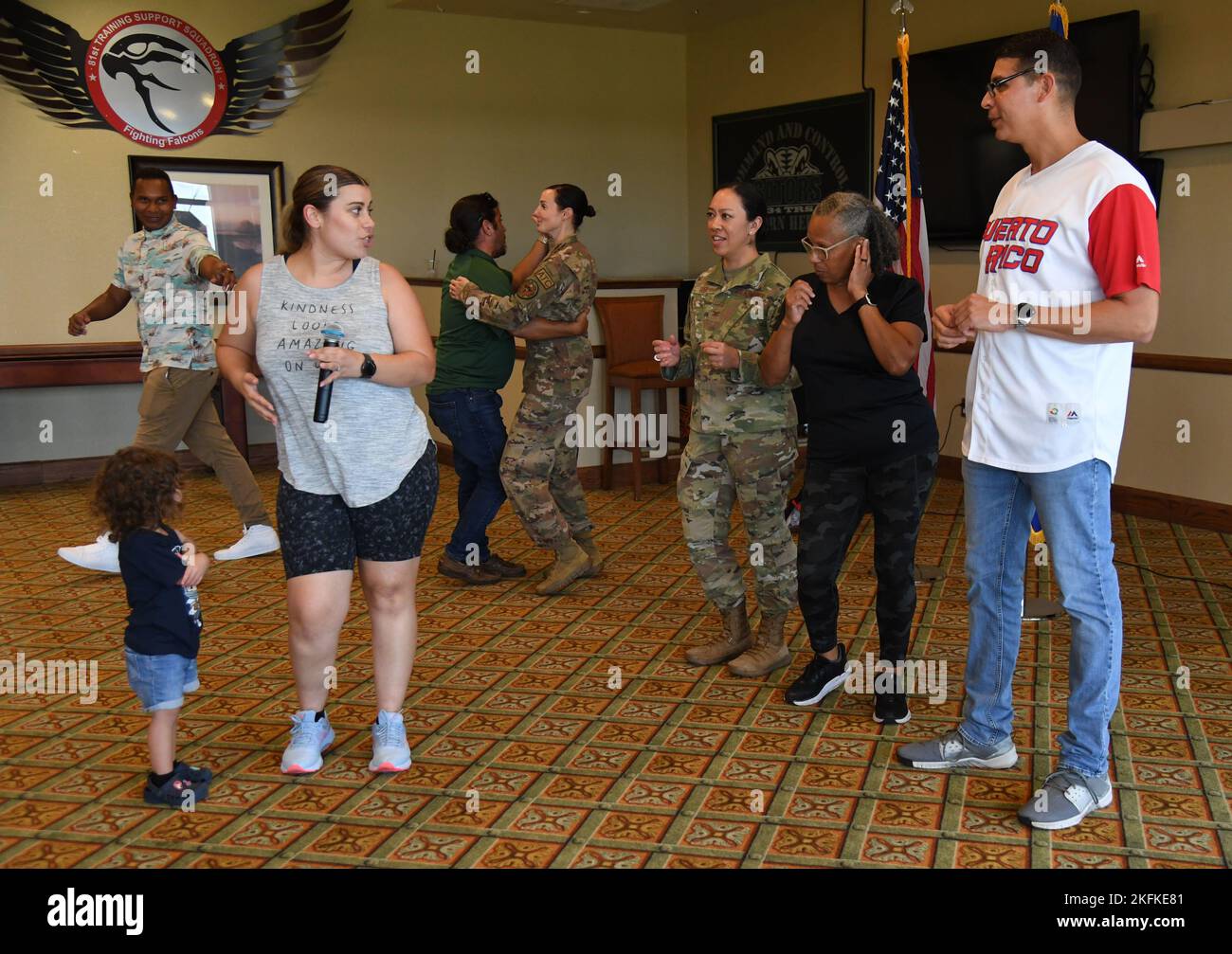 Keesler personnel participate in dance lessons during the Hispanic ...