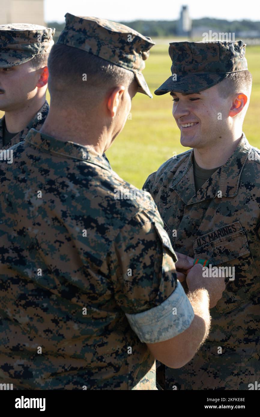 U.S. Marine Corps Lance Cpl. Austin Powell, right, military police ...