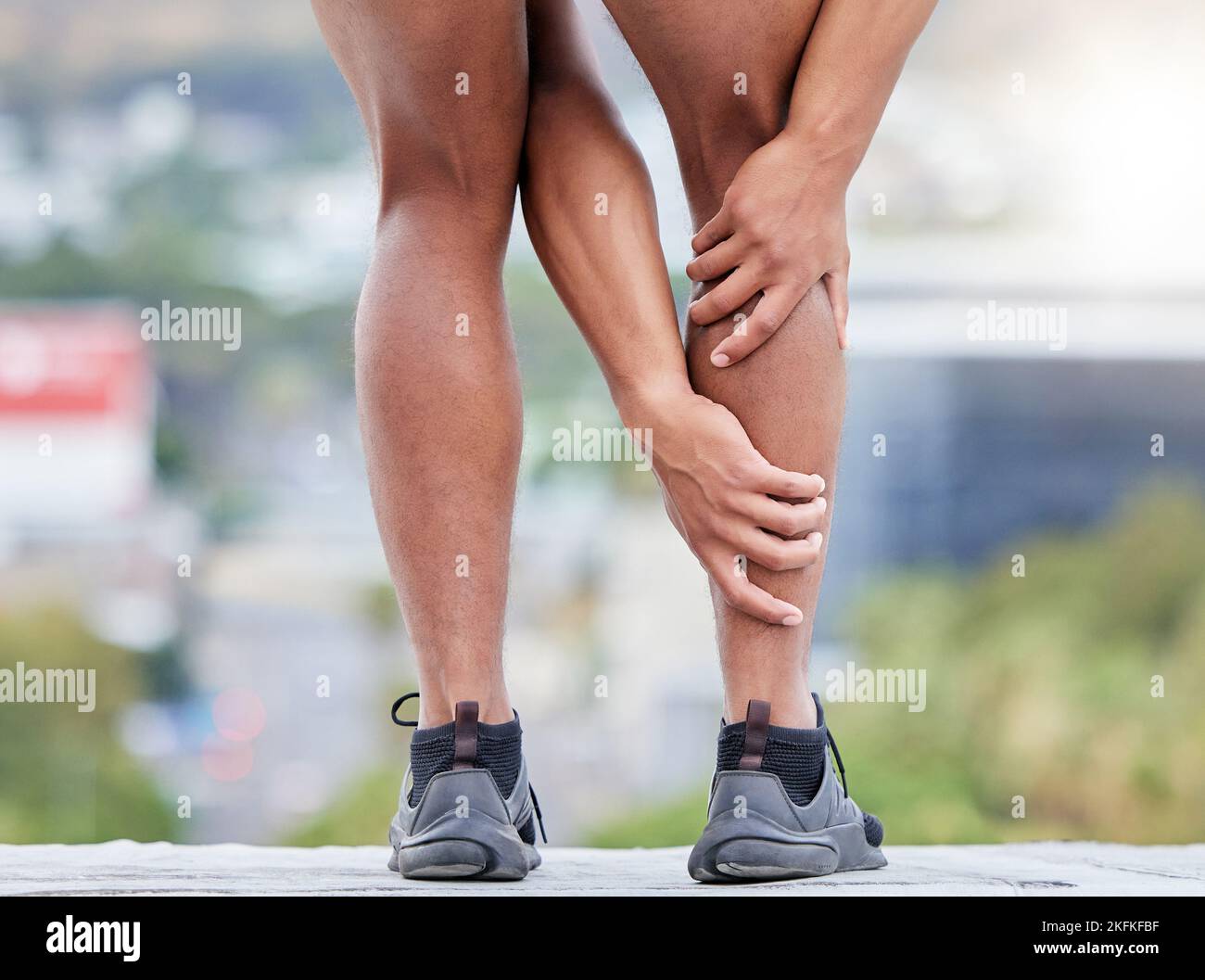 Man, fitness and legs injury on outdoor run for sports marathon ...